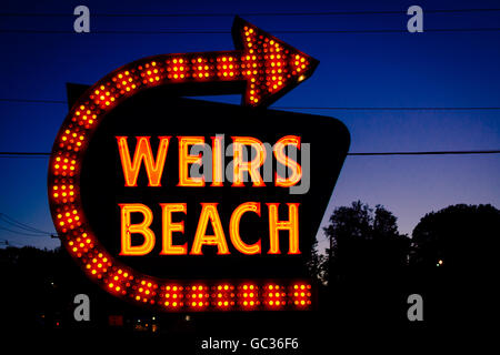 The Weirs Beach sign at night, in Laconia, New Hampshire Stock Photo ...