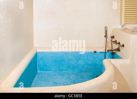 Interior, bathroom with traditional Moroccan plaster walls technique ...