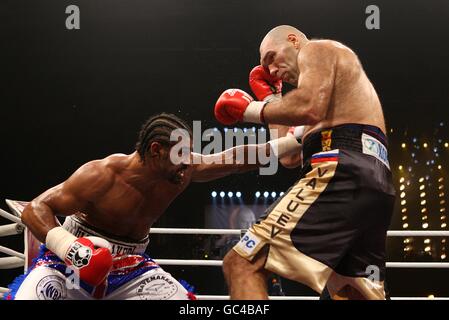 England's David Haye (left) on the attack against Russia's Nikolai ...