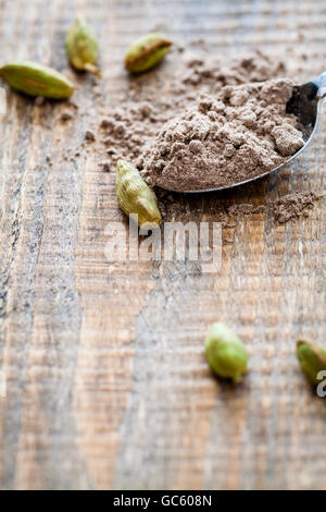 Dry green cardamom pods with seeds falling on white background Stock ...