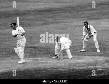 Middlesex's batsman Ronald William Hooker in action looked on by ...