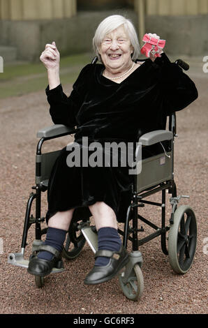 Former EastEnders actress Anna Wing holds her MBE which was awarded to ...