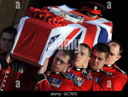The Bearer Party carry the coffin after the funeral for Captain ...