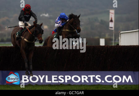 Jockey Charlie Huxley on Sovereign King (left) jumps ahead of Tjade ...