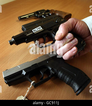 A technician at NABIS (National Ballistics Intelligence Service) holds ...