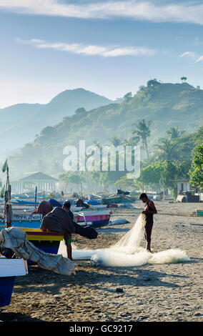 Traditional fishing boat, Timor-Leste. Traditional outrigger boat used ...
