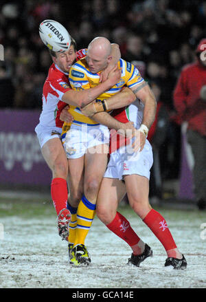 Leeds Rhinos' Keith Senior (centre) is tackled by Celtic Crusaders ...