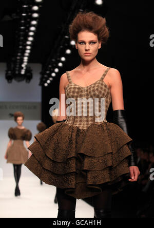 Designer Paul Costelloe and models walk the runway at the Paul ...