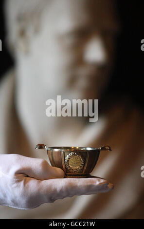 A man holds the WaterlooTree Quaich which belonging to Sir Walter Scott ...