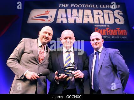 Shrewsbury Town's general manager Jonathan Harris (left) collects the ...