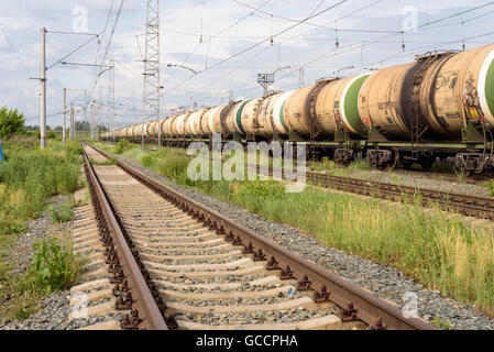 Cargo train carrying containers for gas and fuel Stock Photo - Alamy