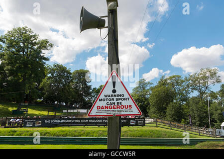 'Motorsport can be dangerous' warning sign Stock Photo - Alamy