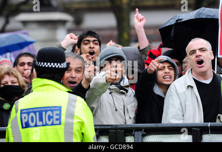 A Unite Against Fascism supporter protests against the English Stock ...