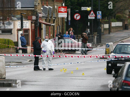 Scenes of crime officers at work at the site of a shooting incident in ...