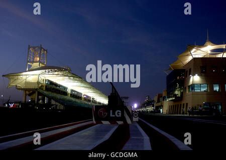 A general view of the starting straight and pit entrance at night ...