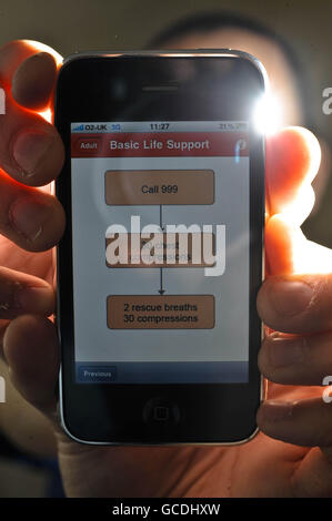 Developer of the iResus app, Dr Daniel Low holds his iPhone at the ...