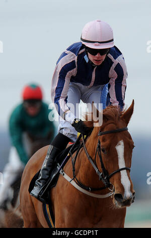 Jockey Matthew Davies on Kummel Excess (right) gallops against Graham ...