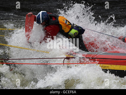 An emergency crew searches the water under the Wapiti River Bridge ...