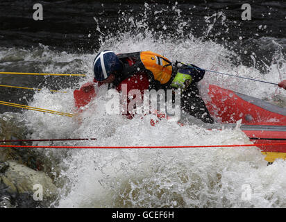 An emergency crew searches the water under the Wapiti River Bridge ...
