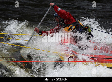 An emergency crew searches the water under the Wapiti River Bridge ...