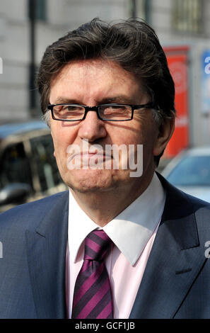 Former Bosnian president Ejup Ganic, center, arrives with his son Emir ...