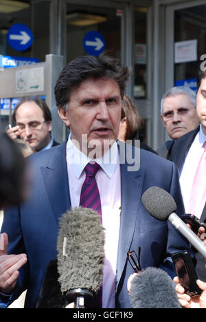 Former Bosnian president Ejup Ganic, center, arrives with his son Emir ...