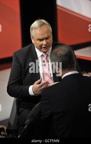 Sky News presenter Adam Boulton holds his cue-cards on the newly ...
