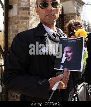 A mourner holds an Order of Service at the funeral of former Fianna ...