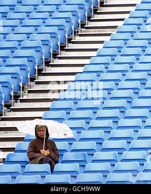 A lone fan sits in the empty student section late in the second half of ...