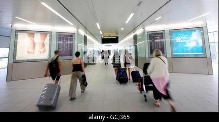 A general view of air passengers walking through the new south terminal ...