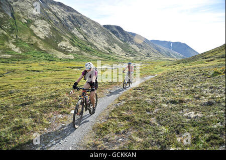 Women ride full suspension mountain bikes on the Resurrection Pass ...