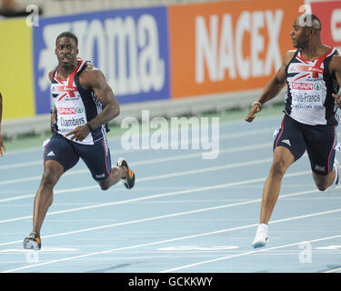 Mark Lewis-Francis looks across as crosses the finishing line as he ...