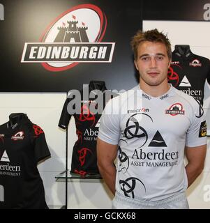Edinburgh's Alex Grove wearing the away kit, Macron's Fabio Malipiero ...
