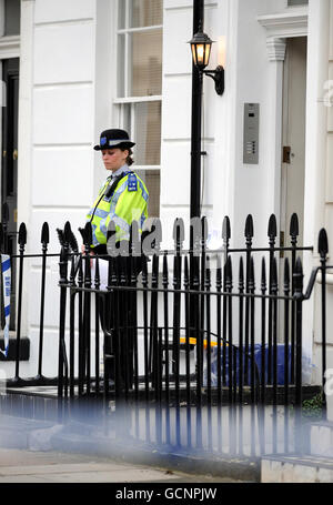 A PCSO stands outside a building where the body of an unnamed man was ...