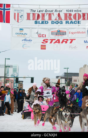 DeeDee Jonrowe and team leave the ceremonial start line with an ...