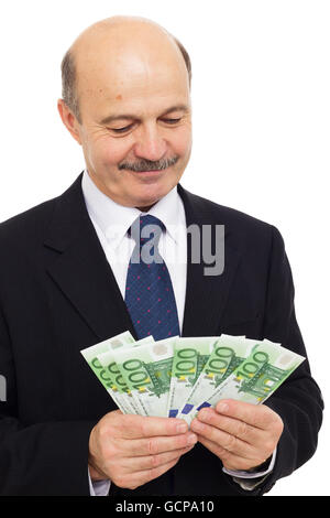 Satisfied businessman loves money and sniffing them with admiration ...