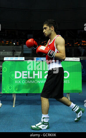 Pakistan's Haroon Kahn prepares to fight against Mauritius' Gilbert ...
