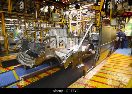 Ford workers assemble Transit vans at their factory in Southampton ...