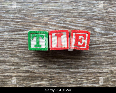 TIE word written with wood block letter toys Stock Photo - Alamy