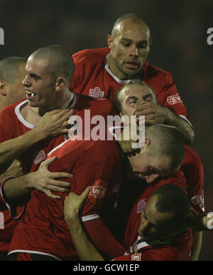 FC United of Manchester's Jake Cotterill (second left) celebrates ...