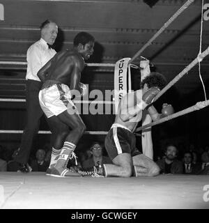 Clinton McKenzie, left, looks on at the knocked down Steve Early ...