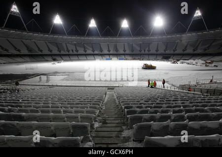 Stadium seats are covered in snow before an NFL football game between ...