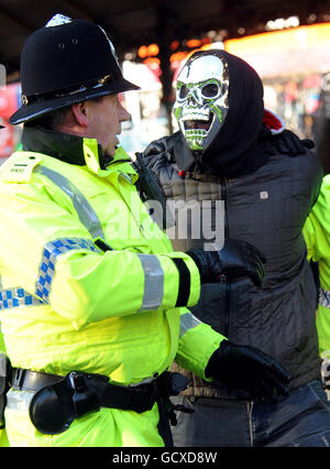 A man is led away by police during a Defend Our Juries protest in ...