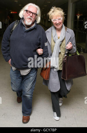 Comedian Jenny Eclair with her partner Geoff Powell arrive at Heathrow ...