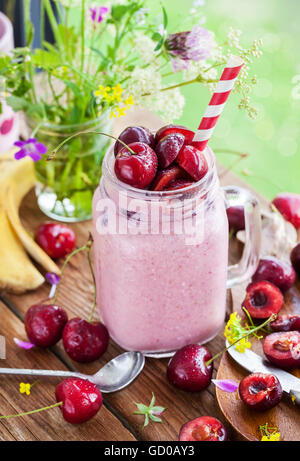 Healthy and delicious homemade smoothie(s) with a flower on a table ...