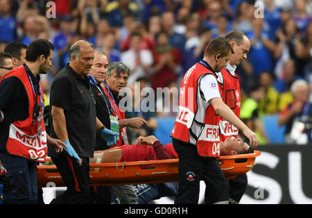 Cristiano Ronaldo of Portugal is carried on a stretcher after being ...