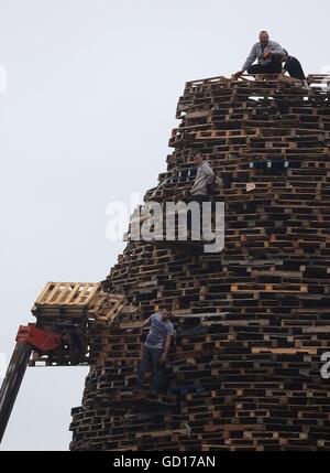 Men construct a bonfire in the Ballymacash area of Lisburn, as building ...