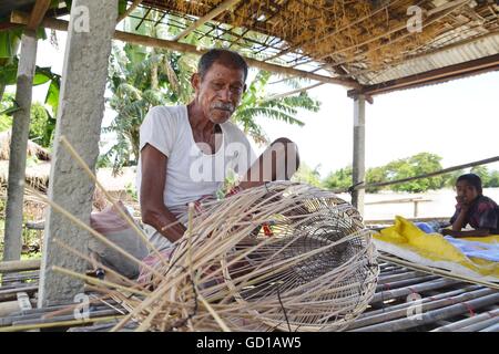 Golaghat, India. 10th July, 2016. A mishing tribal woman busy in ...