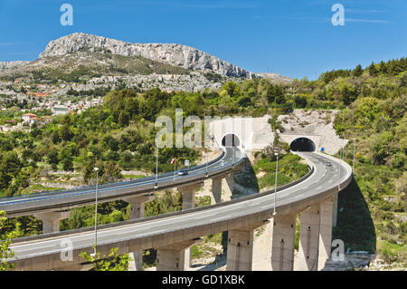 croatian motorway with curved viaducts and tunnel entrance near klis ...