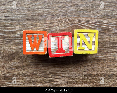 WON word done with wood block letter toys Stock Photo - Alamy